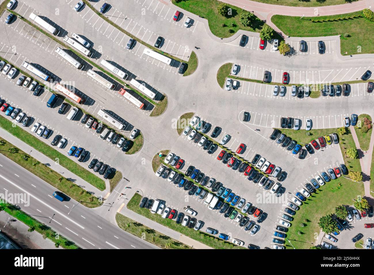 outdoor carpark with rows of cars in urban landscape. aerial top view ...