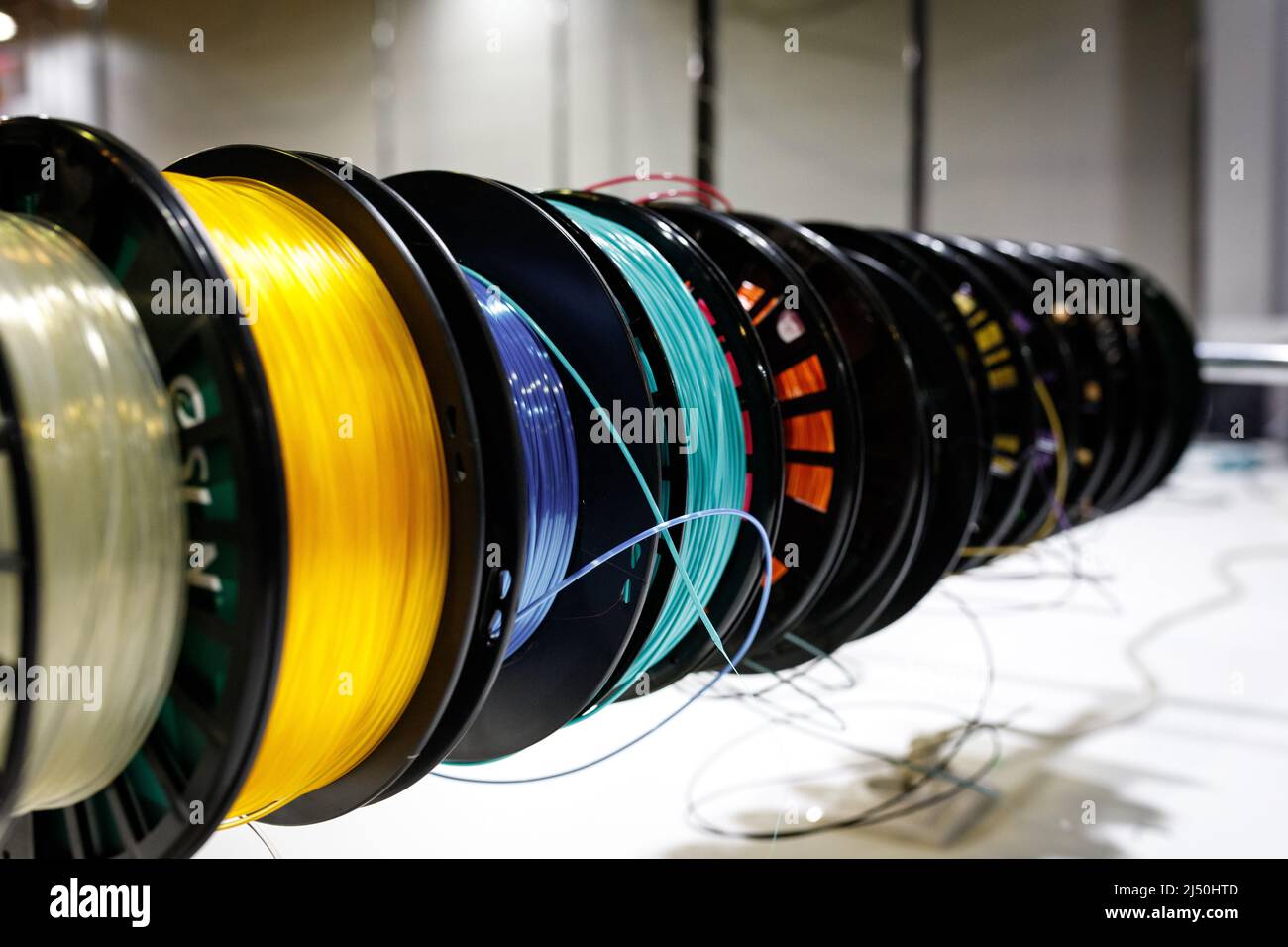 Side view of Colorful plastic PLA and ABS spools with filament for ...