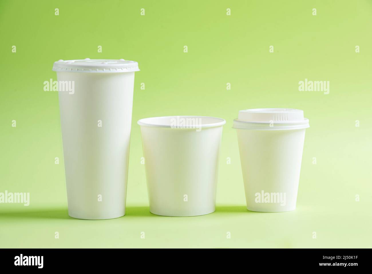 White plastic cup with colored background Stock Photo - Alamy