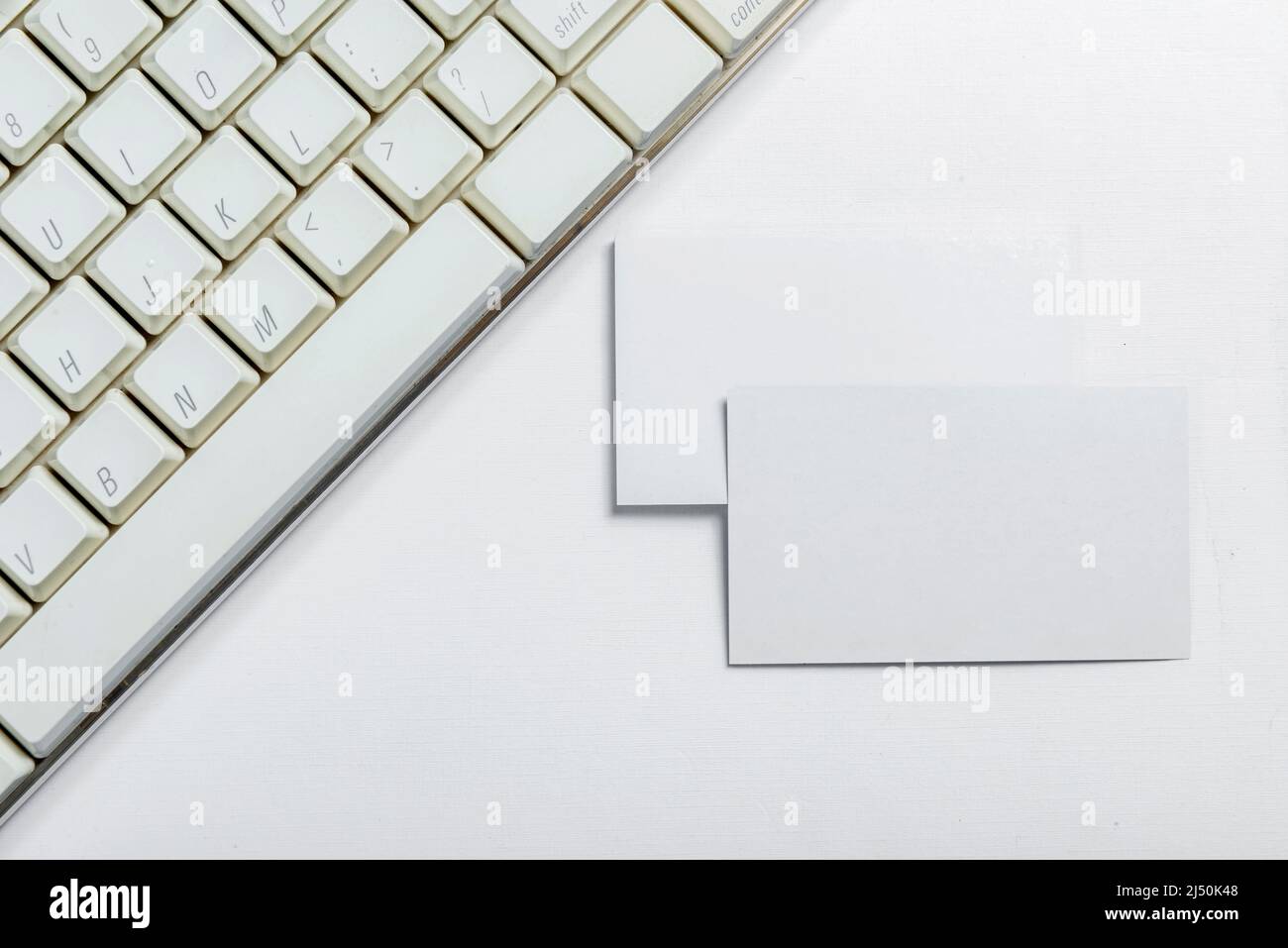 Computer keyboard and empty white paper on the desk. Empty white paper ...