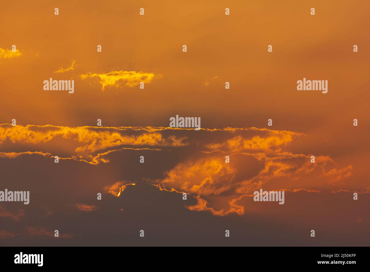 Beautiful dramatic clouds in the sunset yellow sky Stock Photo - Alamy