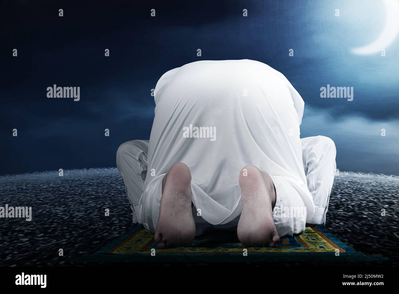 Close up view of a Muslim man in a praying position (salat) on a prayer ... Close up view of a Muslim man in a praying position (salat) on a prayer ...