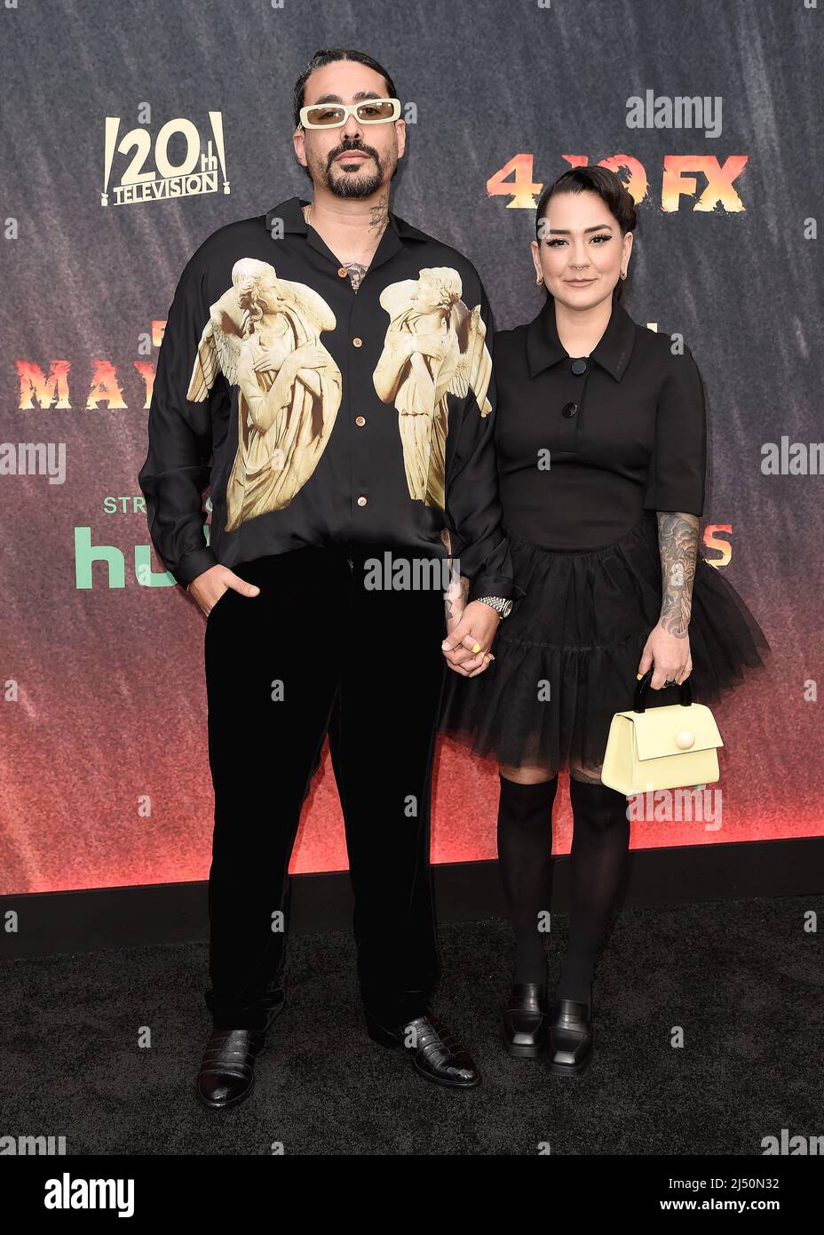 Gino Vento and Mia Keller walking on the red carpet at FX's "Mayans M.C ...