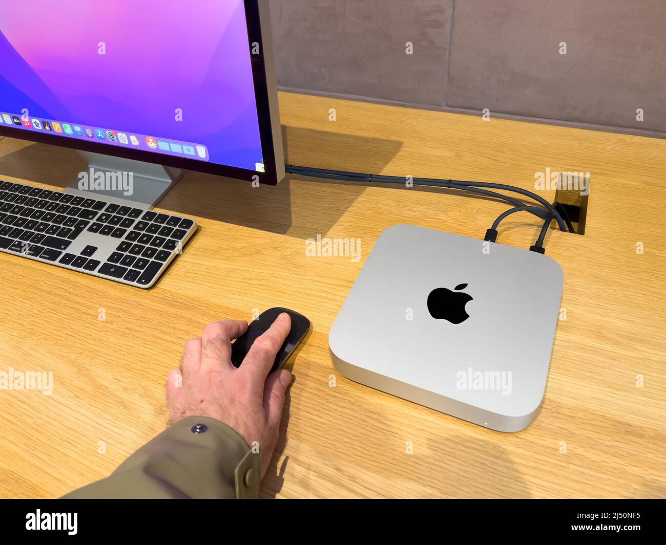 Paris, France - Ap 7, 2022: Male hand working on the computer new Mac ...