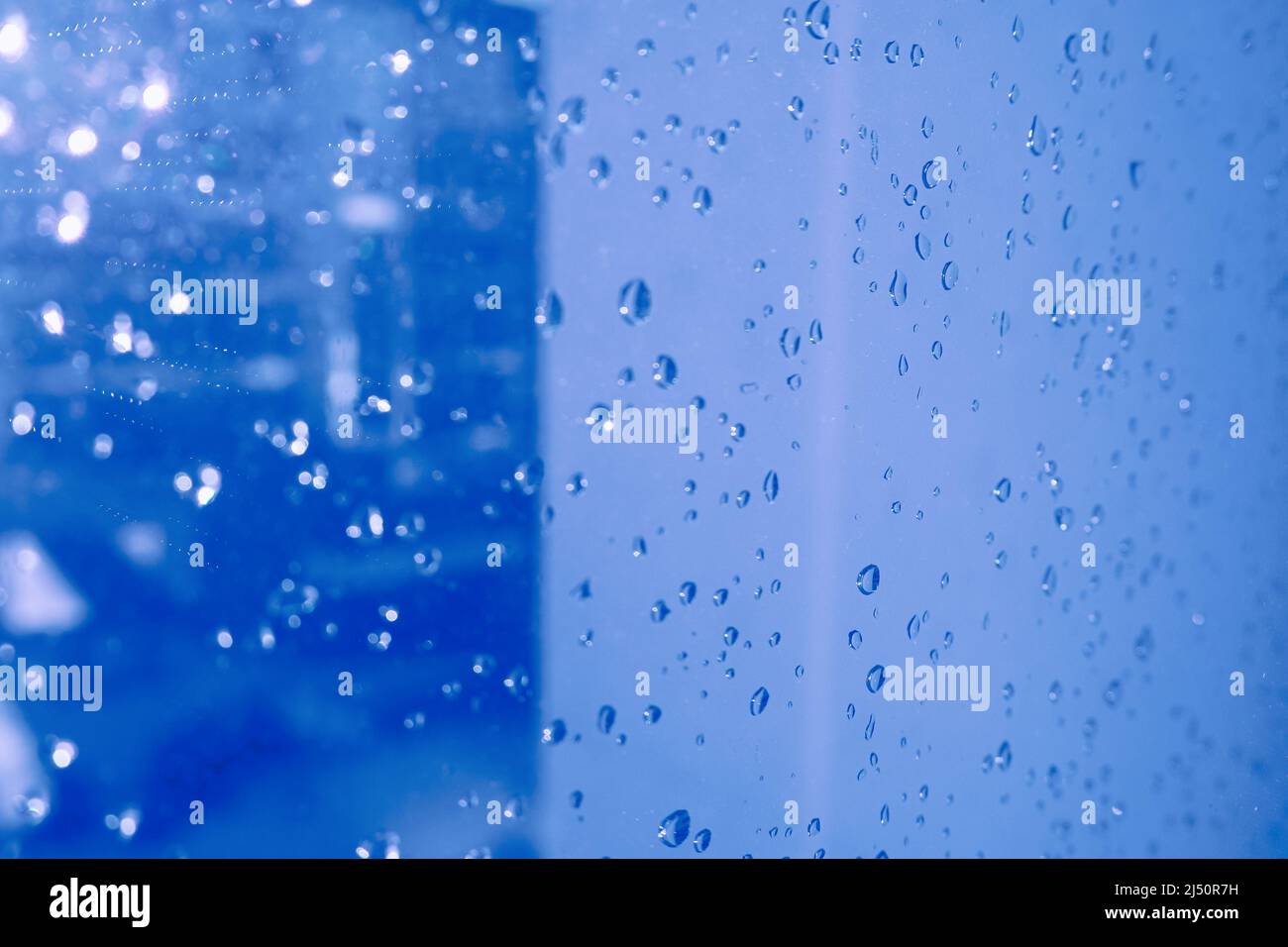 rain drops on window blue background. melancholy mood Stock Photo - Alamy