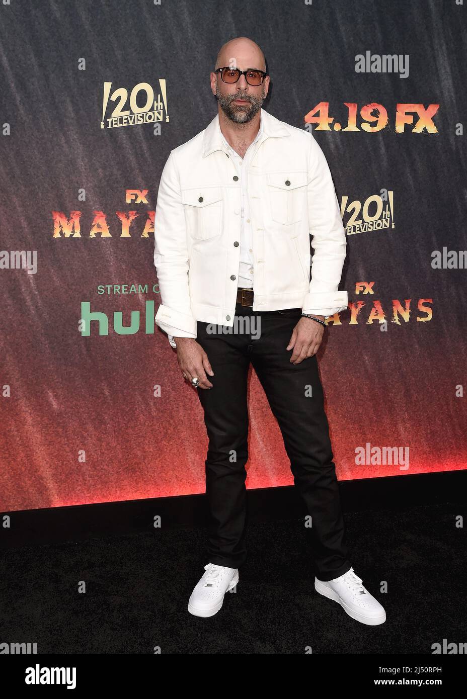 Greg Vrotsos walking on the red carpet at FX's "Mayans M.C." season 4 ...