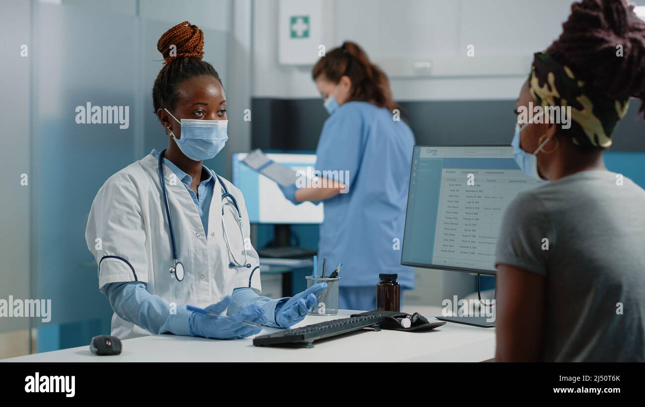Doctor asking patient to sign consultation papers for prescription ...