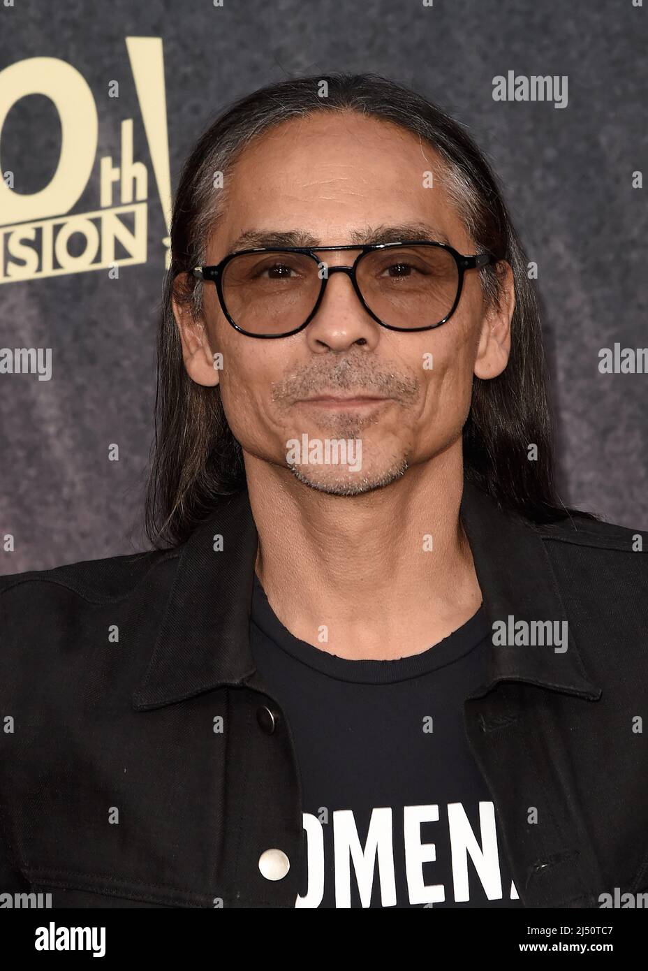 Los Angeles, USA. 18th Apr, 2022. Zahn McClarnon walking on the red ...