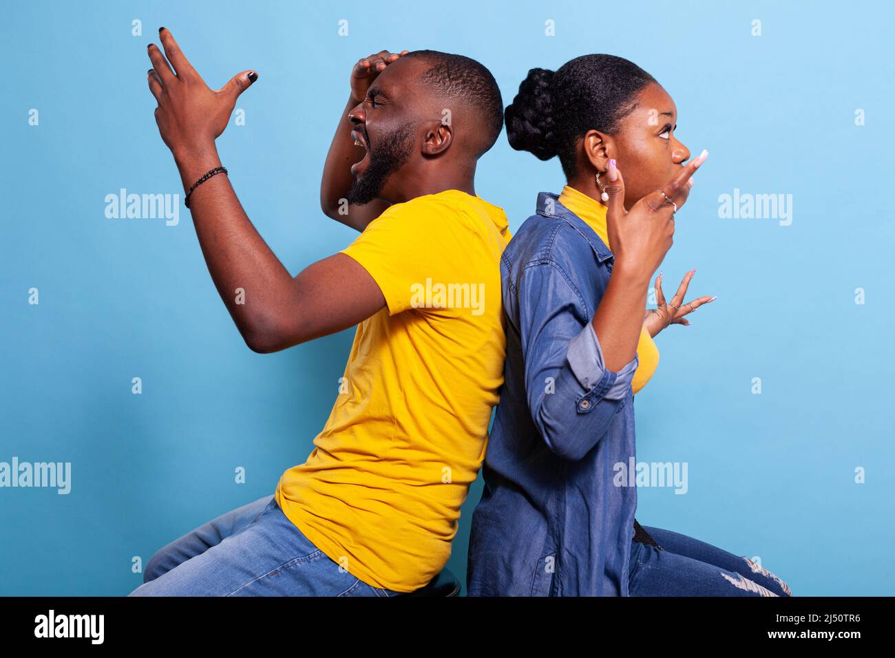 Two angry people back to back hi-res stock photography and images - Alamy