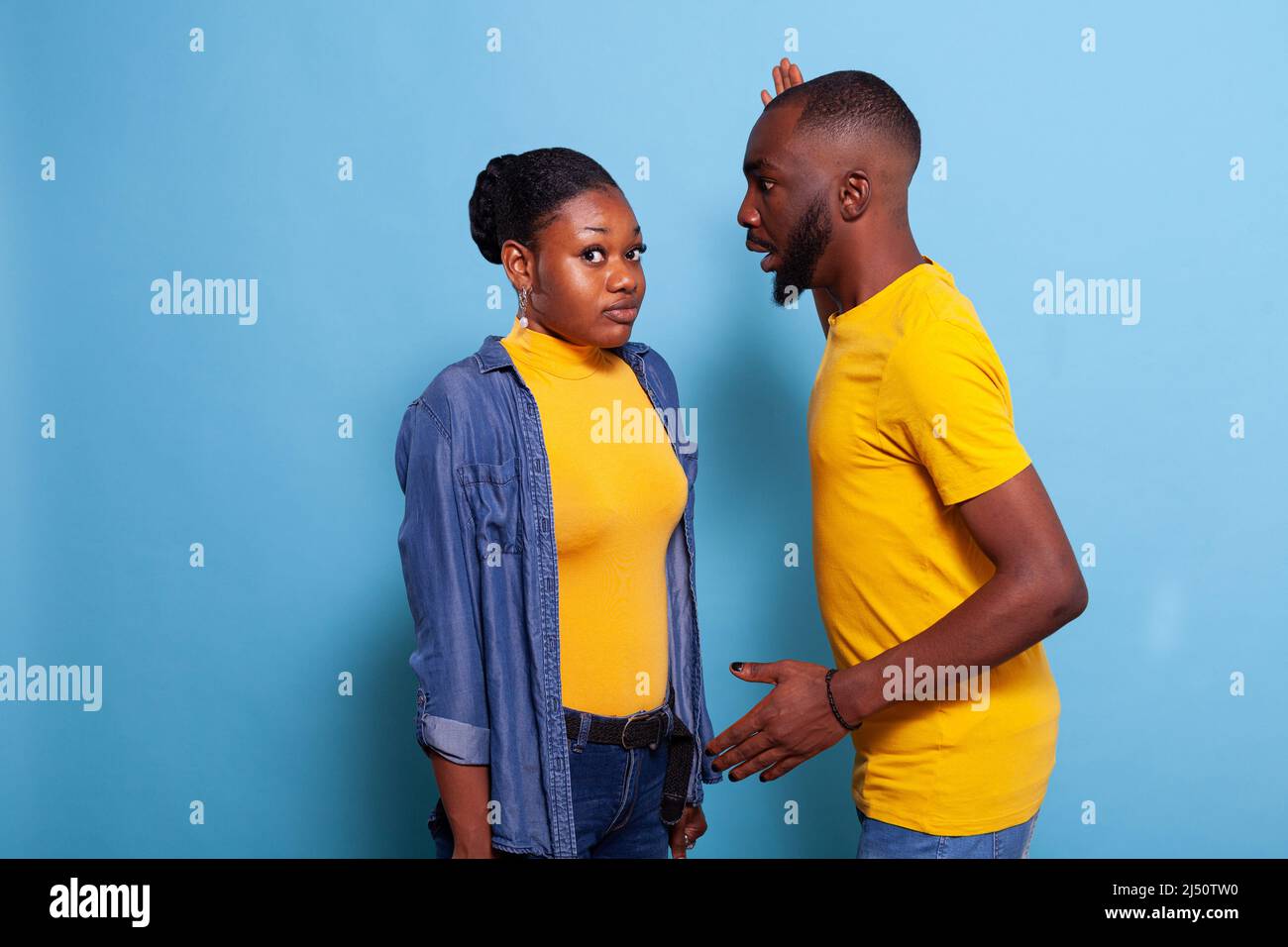 Angry boyfriend raising hand at girlfriend and arguing. Couple in ...