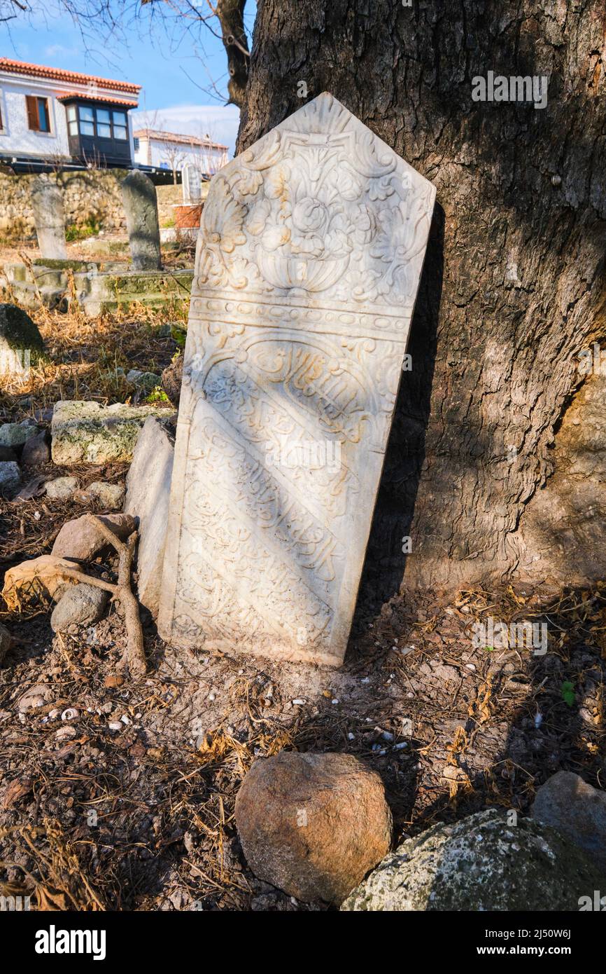 An old, traditional, stone headstone, grave behind the Memiş mosque. In ...