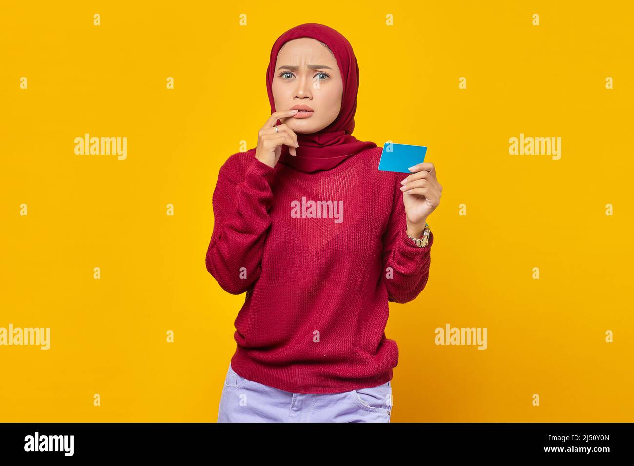 Beautiful Asian woman looking stressed and nervous with biting nails ...