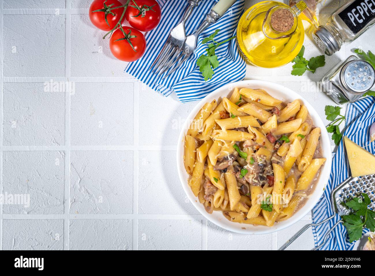 Italian mediterranean lunch concept. Penne pasta with creamy carbonara ...