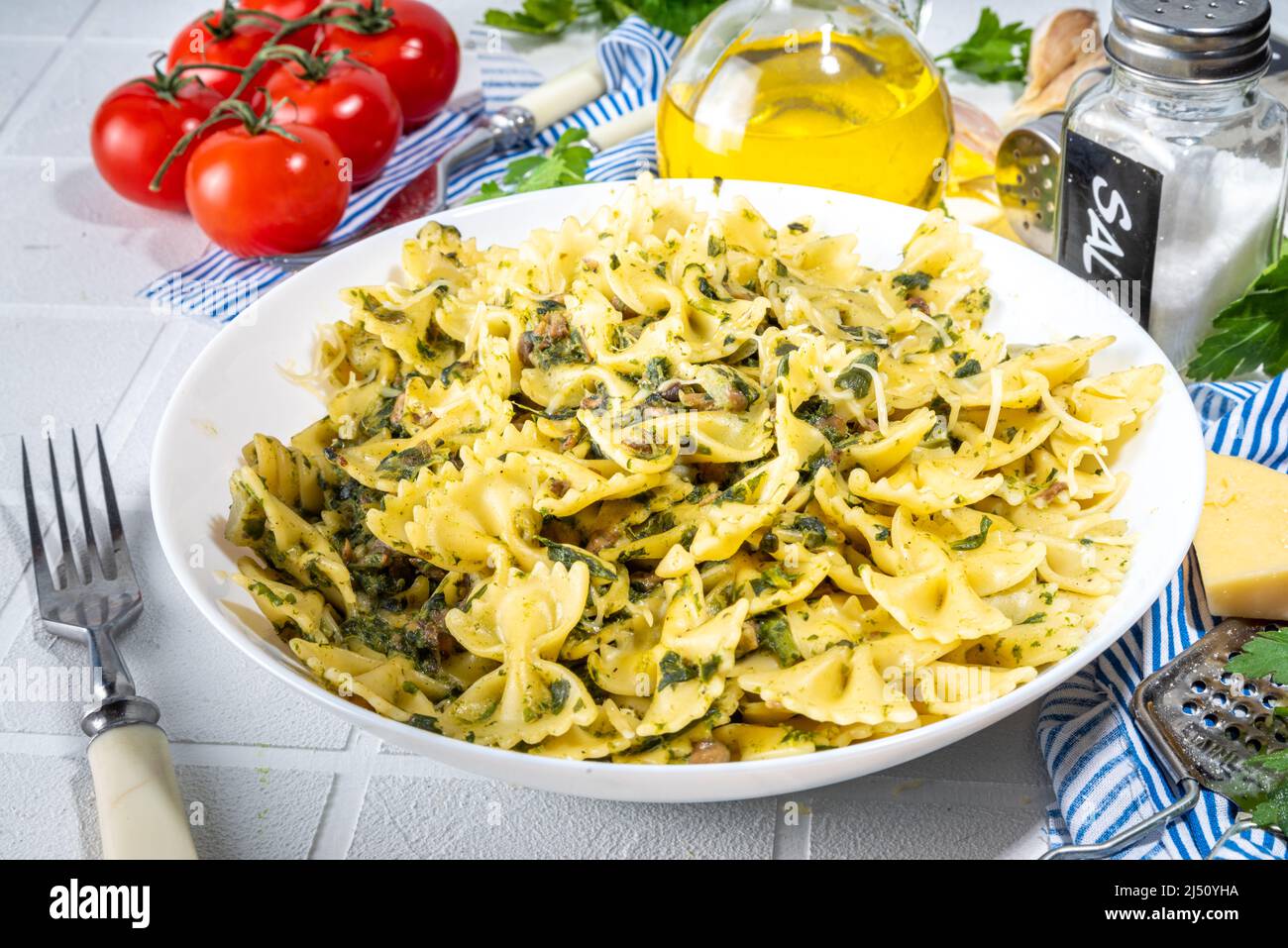 Italian mediterranean lunch concept. Farfalle pasta with spinach ...