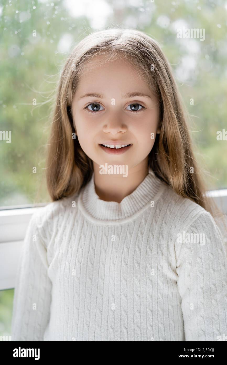 Adorable girl at window hi-res stock photography and images - Alamy