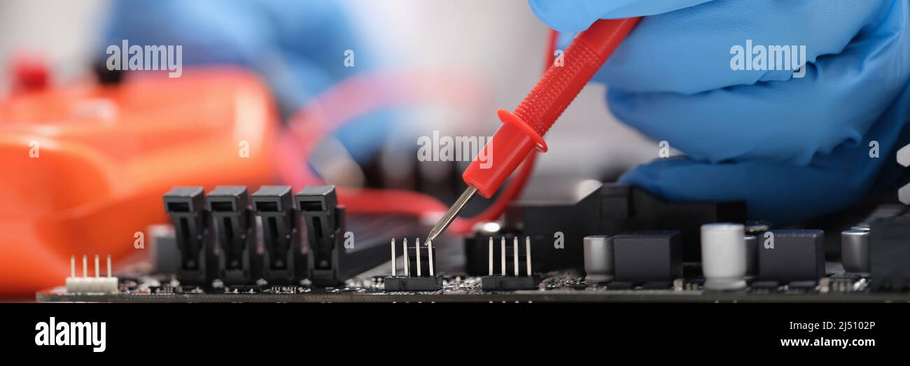 Master repairer testing motherboard with feeler gauge closeup Stock ...