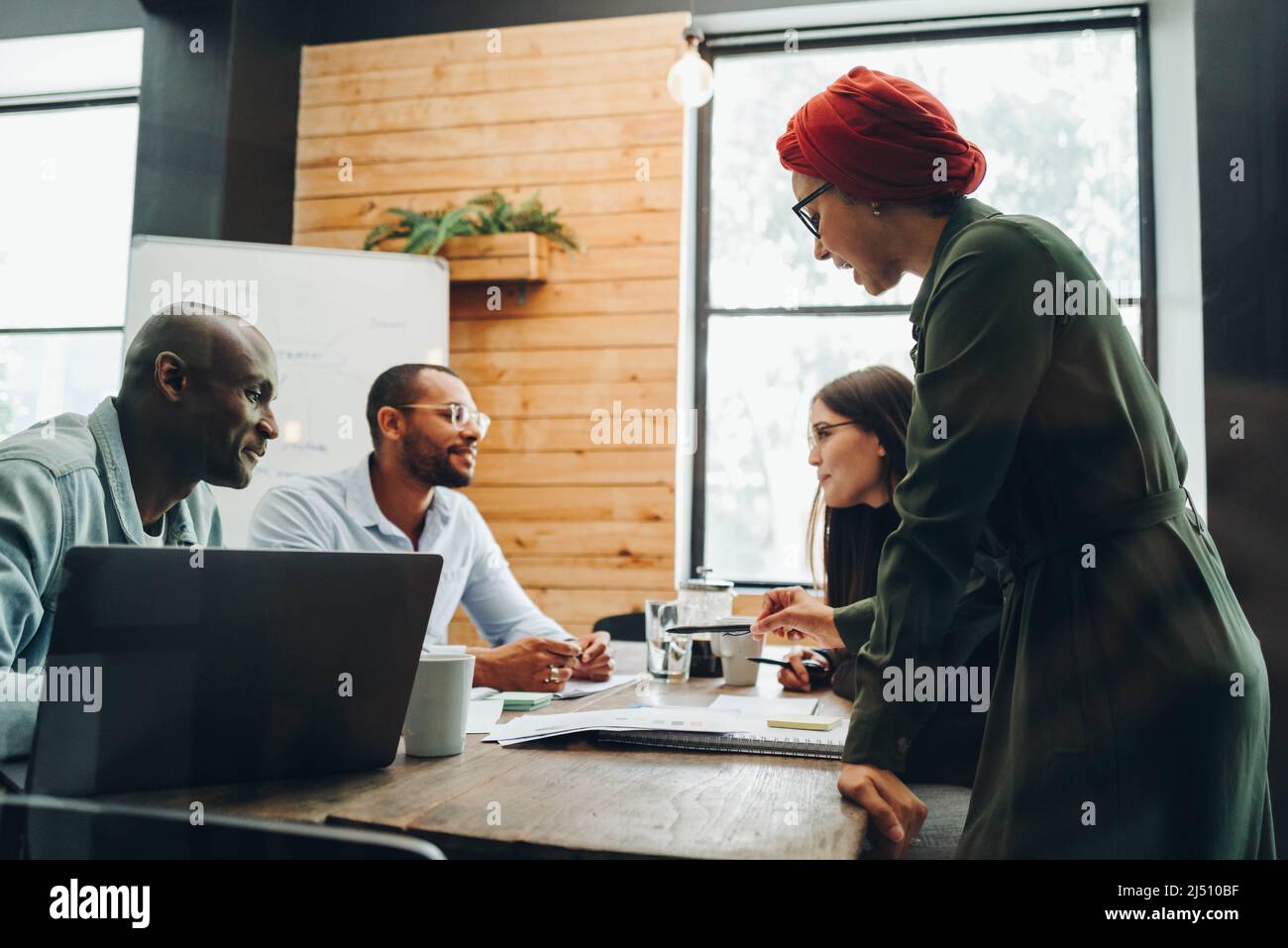 Group of diverse businesspeople having discussions during a boardroom ...