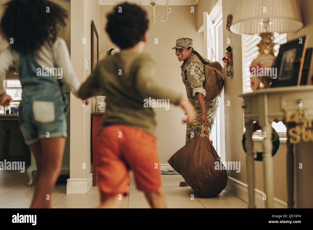 Happy military mom returning home to her children after deployment ...