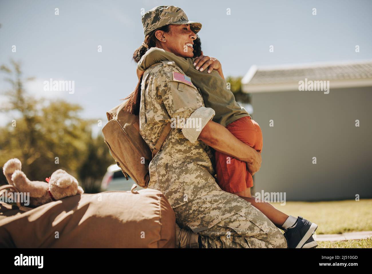 Joyful Military Mom Embracing Her Son After Returning Home From The