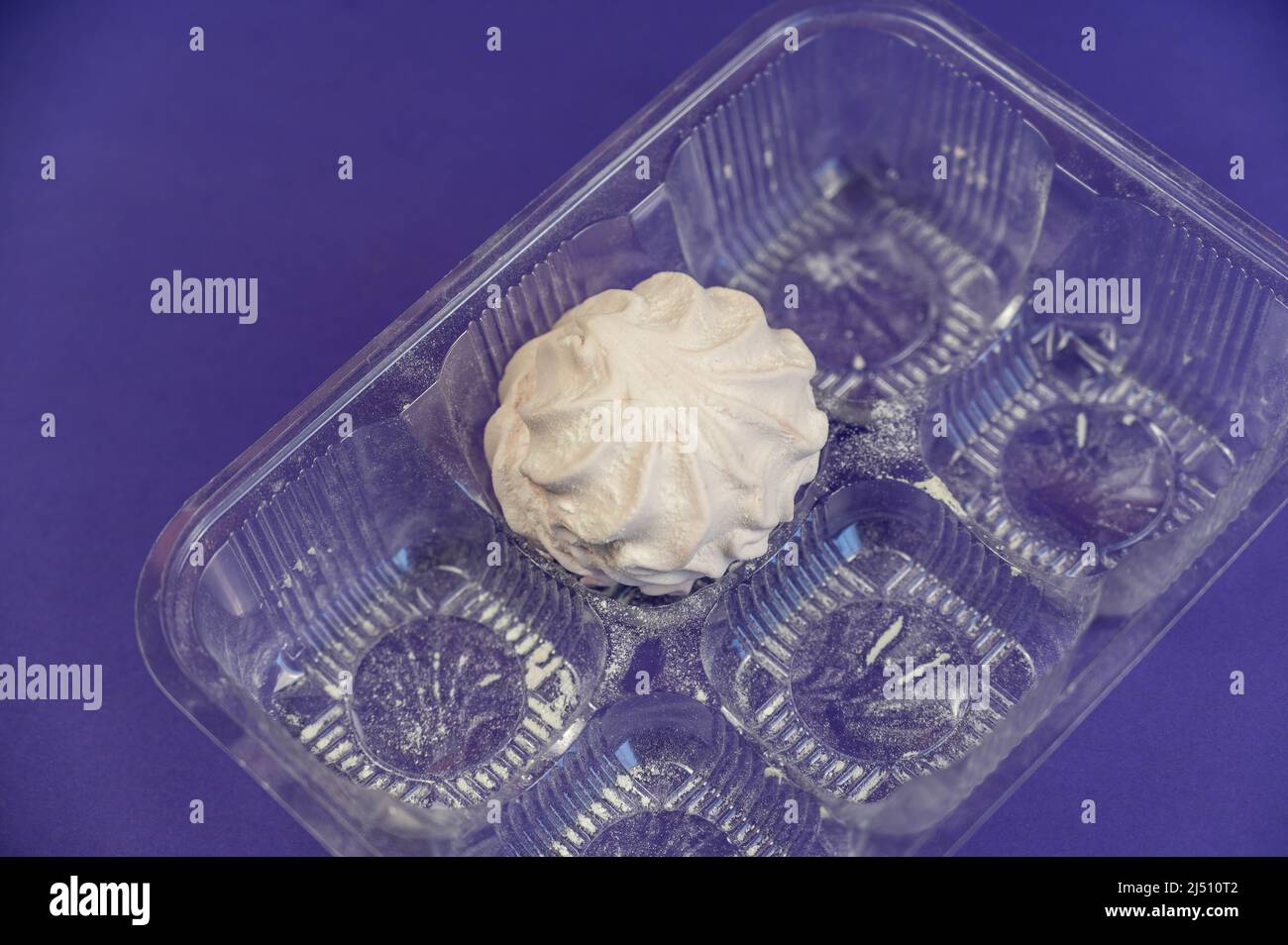 Zephyr and a transparent rectangular tray. A sweet treat against a blue ...