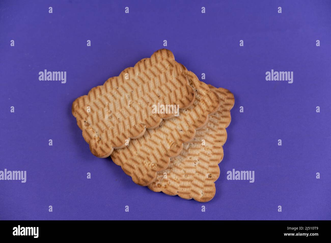 Three rectangular cookies against a blue background. Ready-to-eat ...