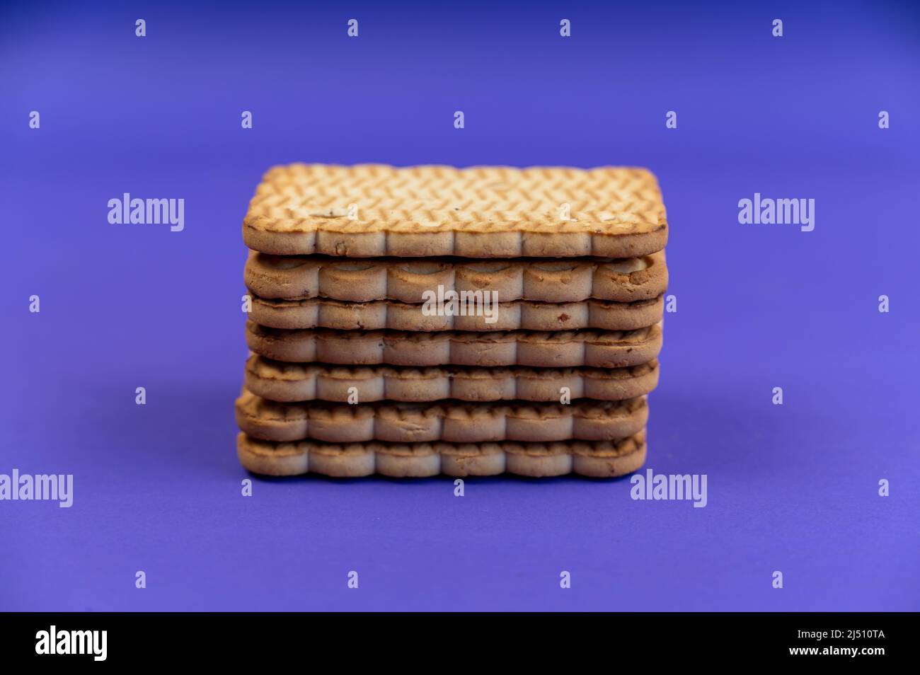 A stack of rectangular cookies against a blue background. Ready-to-eat ...