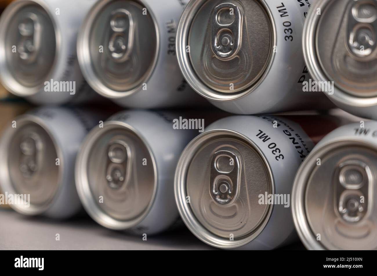 Geometric composition of full tin cans. Drinking water in silver ...