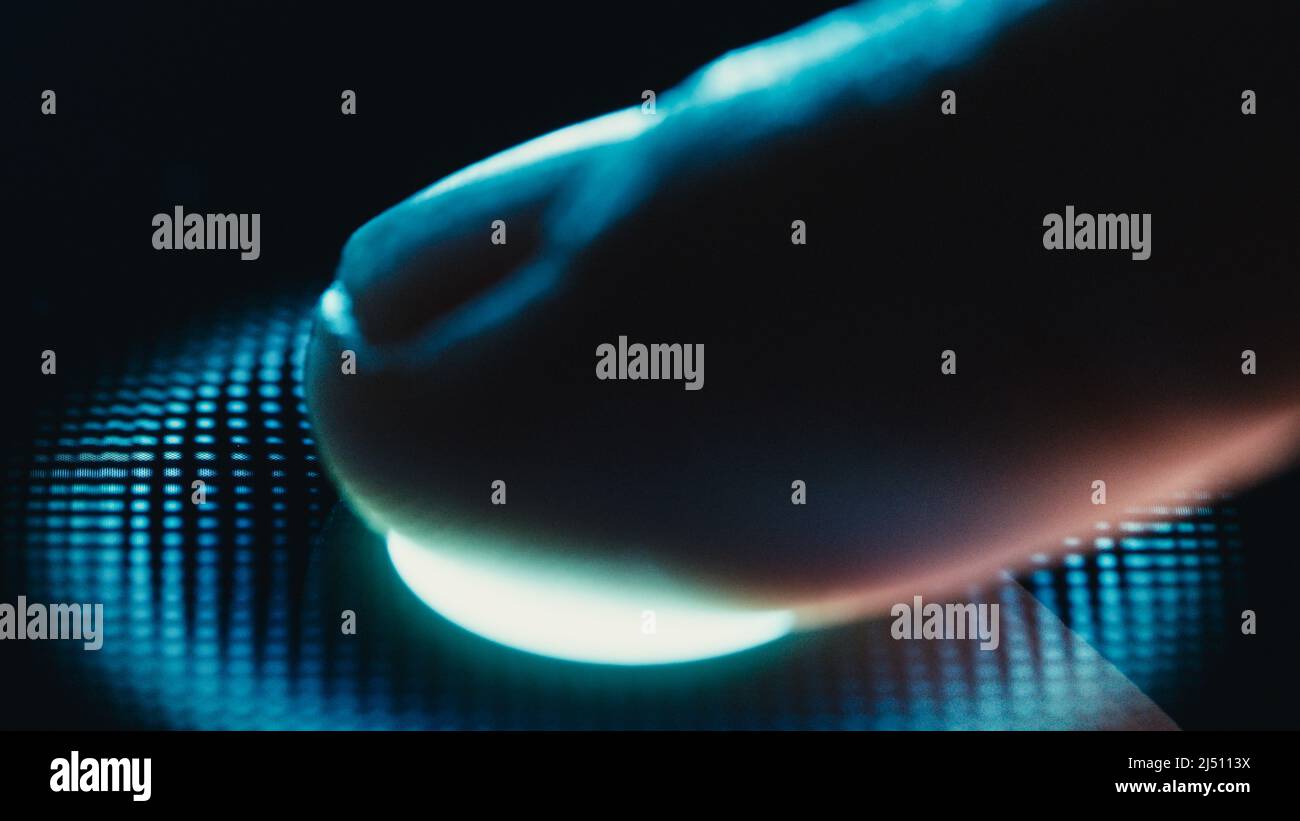 Biometric scanner finger print in action. Close up Stock Photo - Alamy