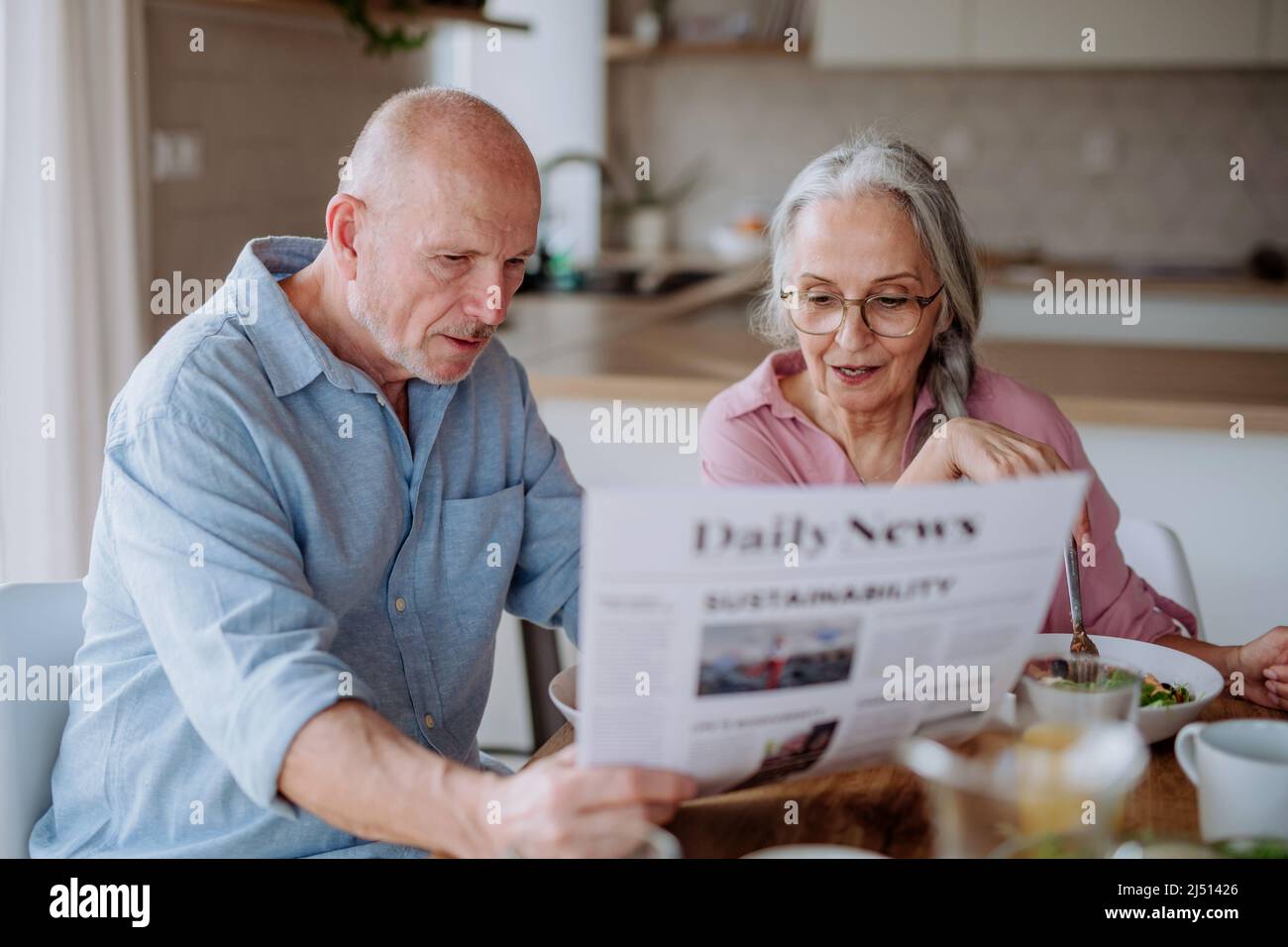 Reading newspaper together hi-res stock photography and images - Alamy