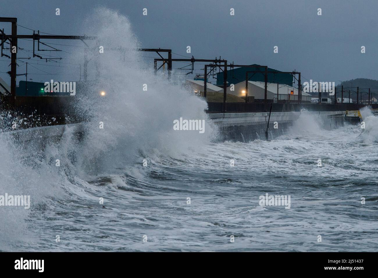 Waves are seen coming over the promenade at west coast Scottish town ...