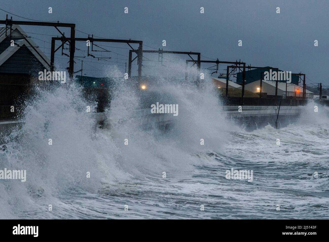 Waves are seen coming over the promenade at west coast Scottish town ...