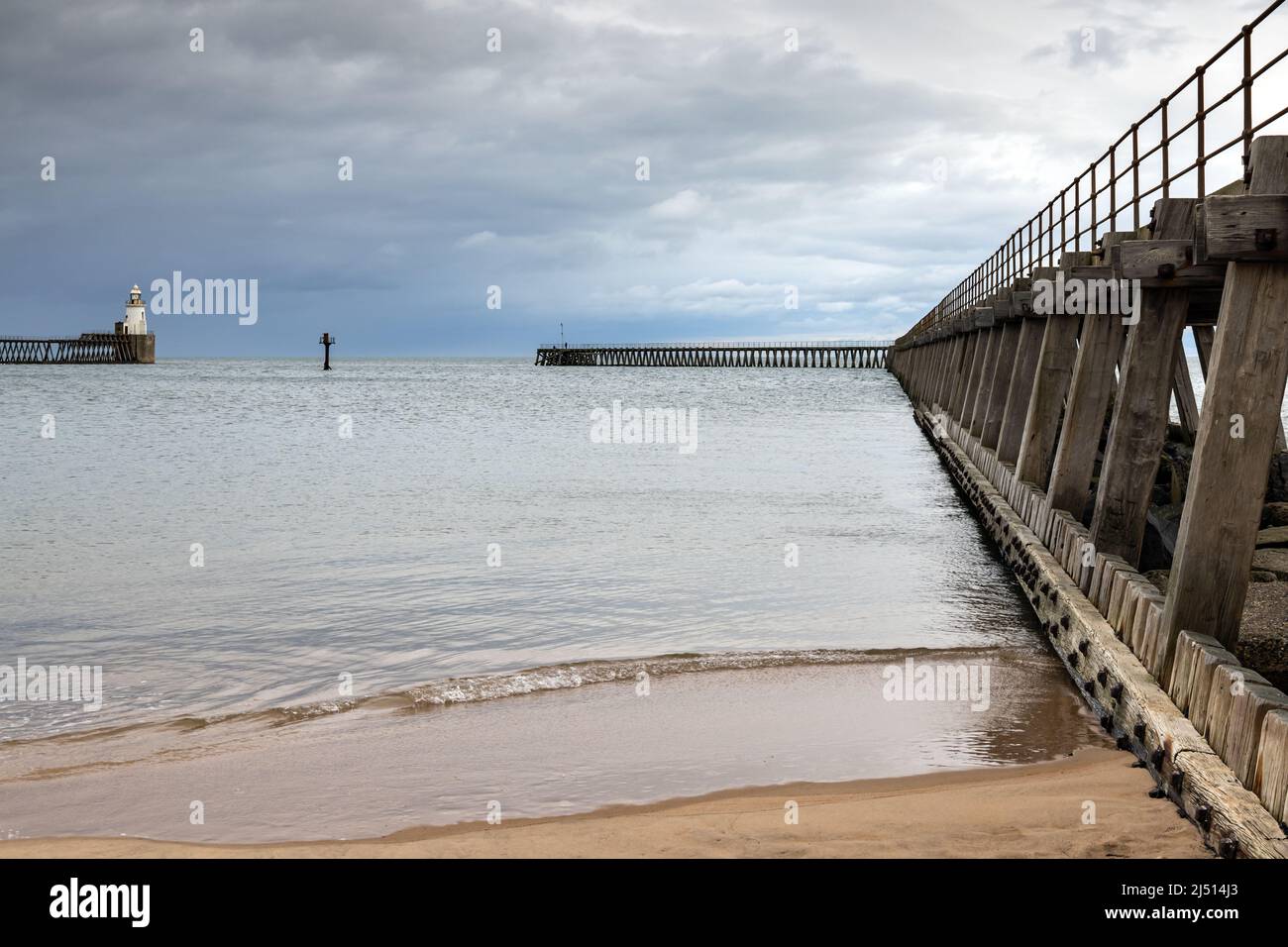 The two old wooden piers protecting the entrance to the Port of Blyth ...