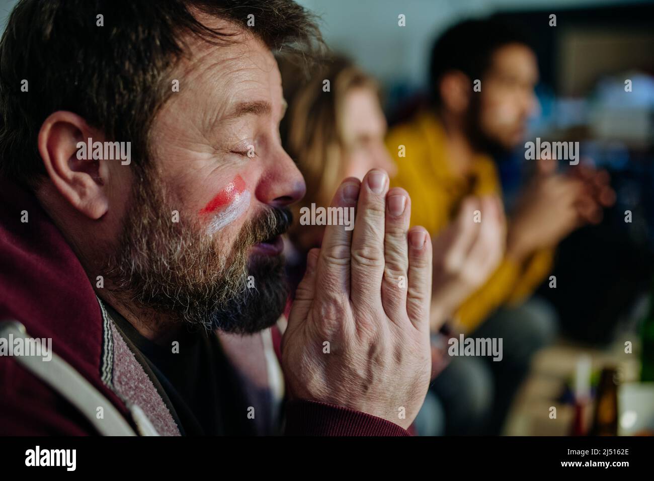 Sport fan praying hi-res stock photography and images - Alamy
