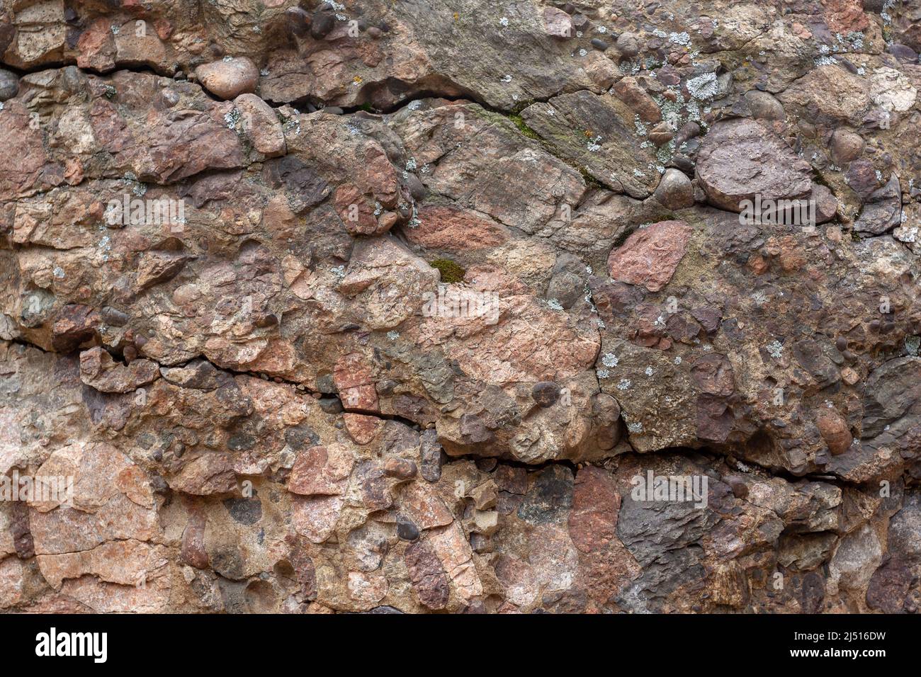 The texture of cracked rock consisting of small stones. Horizontal ...