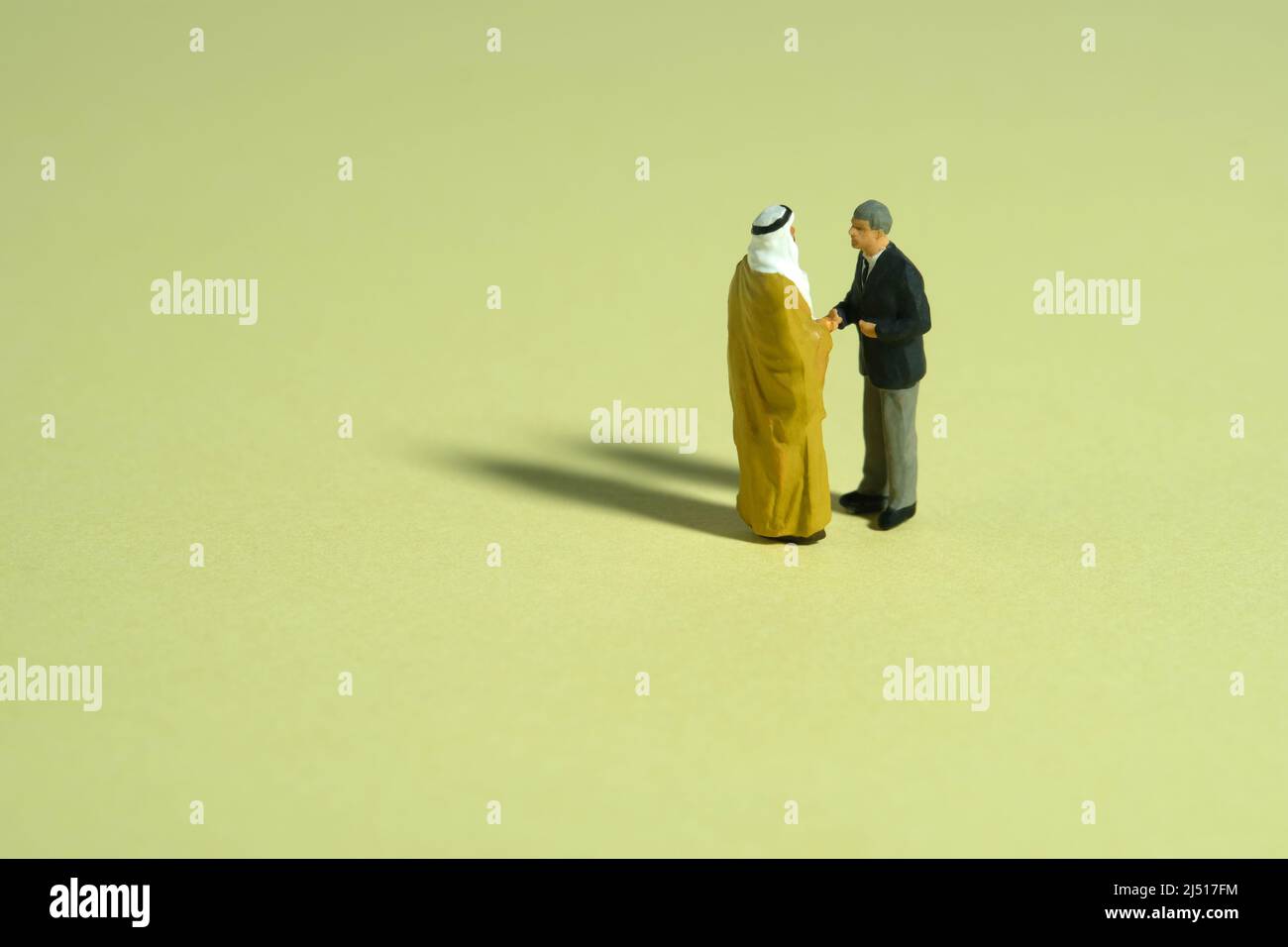 Miniature people toy figure photography. Partnership concept. Sultan ...