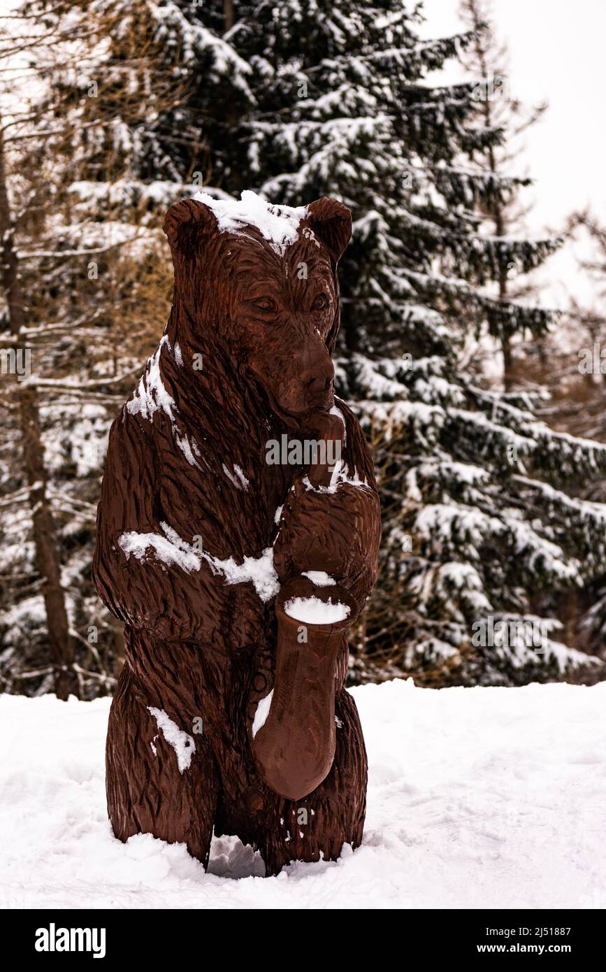 Wooden bear in winter playing musical instrument Stock Photo - Alamy