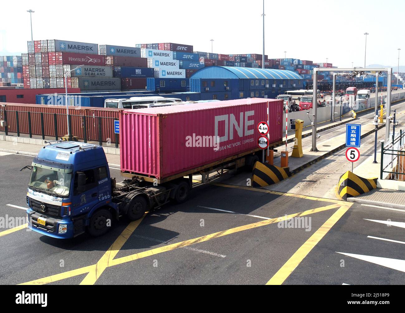QINGDAO, CHINA - APRIL 19, 2022 - A container truck passes through a ...
