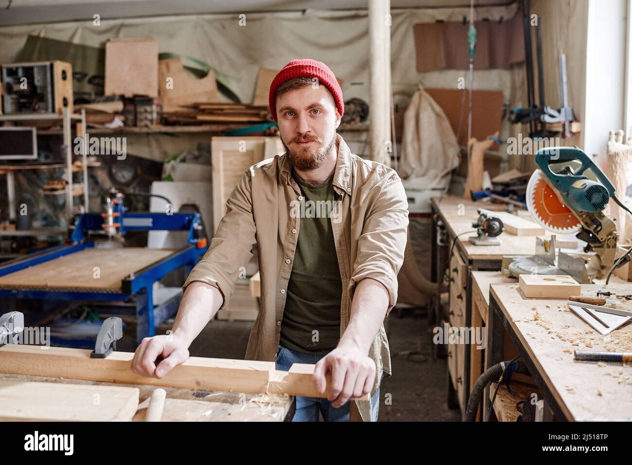 Horizontal medium portrait of young Caucasian man with beard on face ...