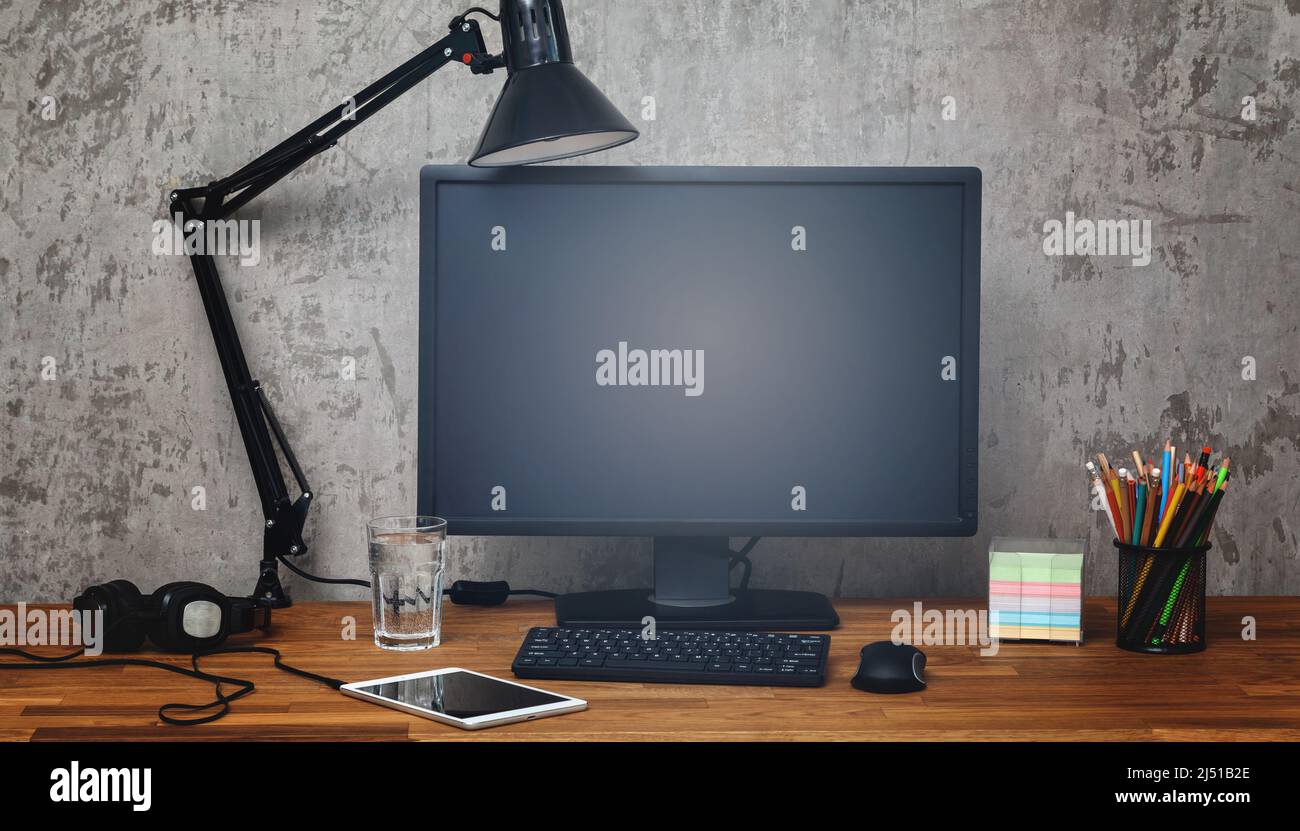 Home workplace - desk with computer in the interior Stock Photo - Alamy