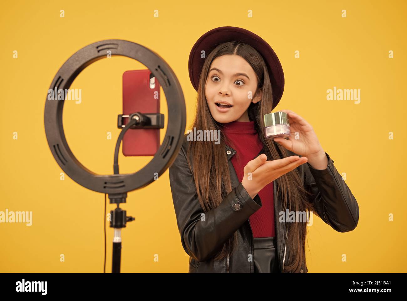 kid beauty blogger. cheerful child do makeup. vlogger with cosmetics ...