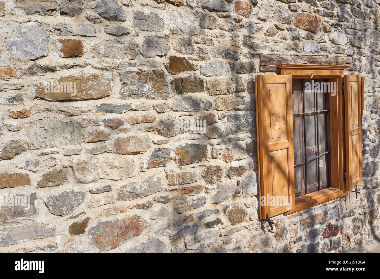 Country house wooden window in stone wall Stock Photo - Alamy