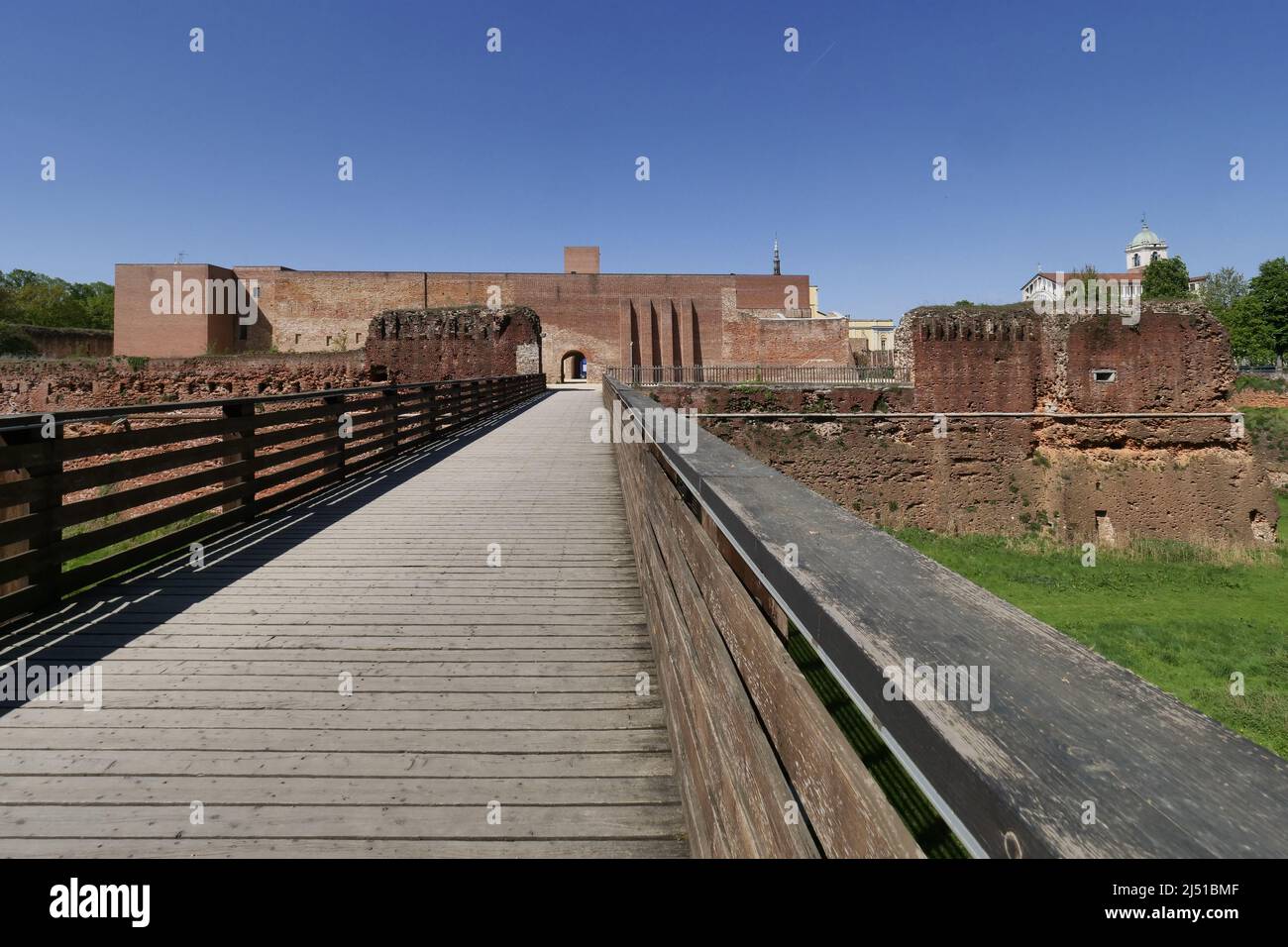 Novara Castle. Wooden bridge and brick castle walls. Novara Castle ...