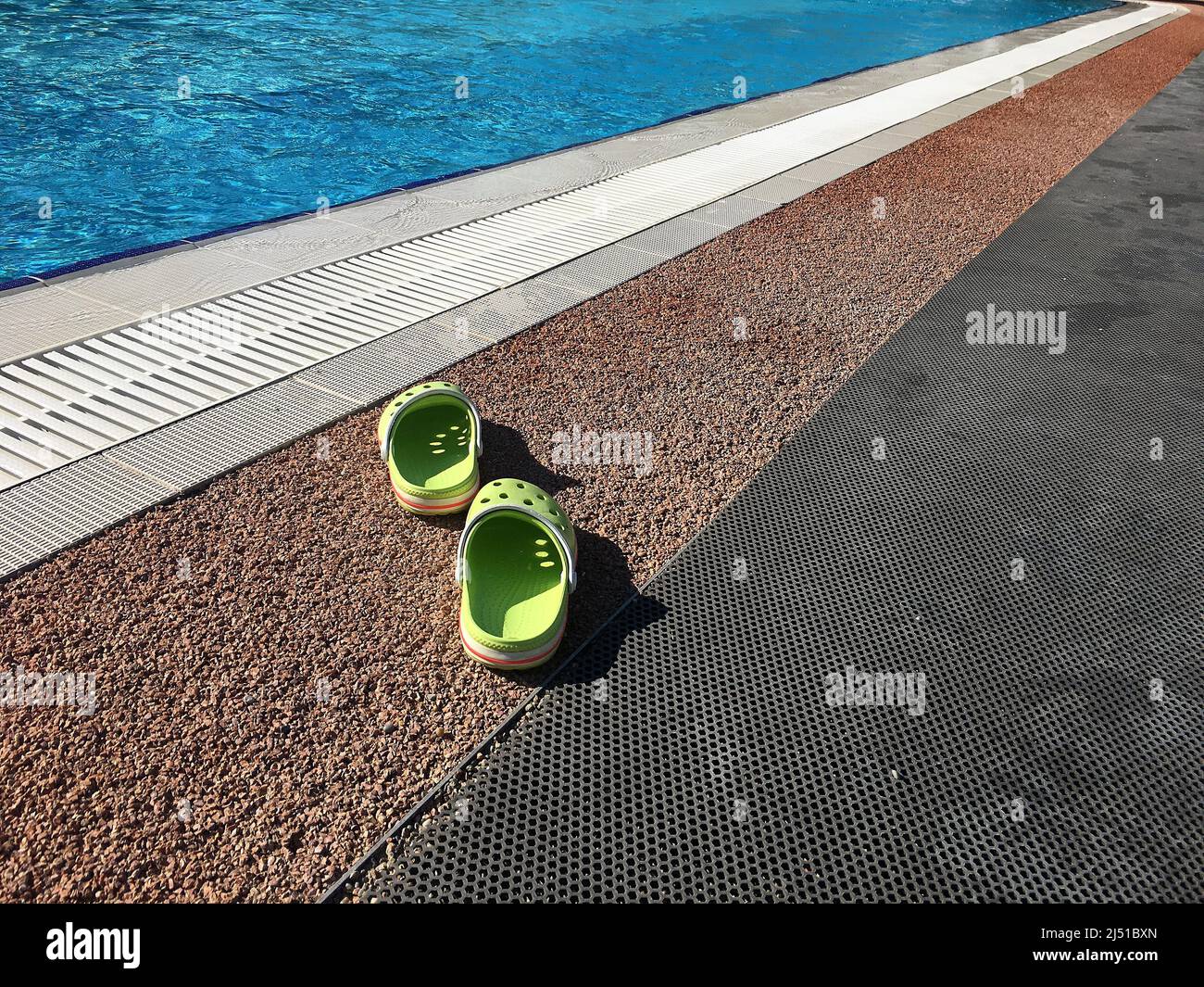Green pool sleepers next to the pool Stock Photo - Alamy