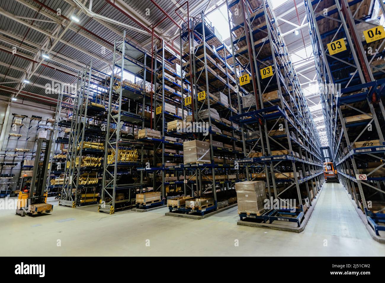 Modern warehouse interior with shelves and boxes Stock Photo - Alamy