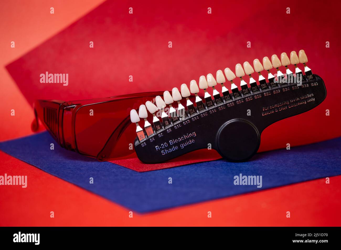 a scale for checking the color of teeth in close-up. Cosmetic dentistry ...