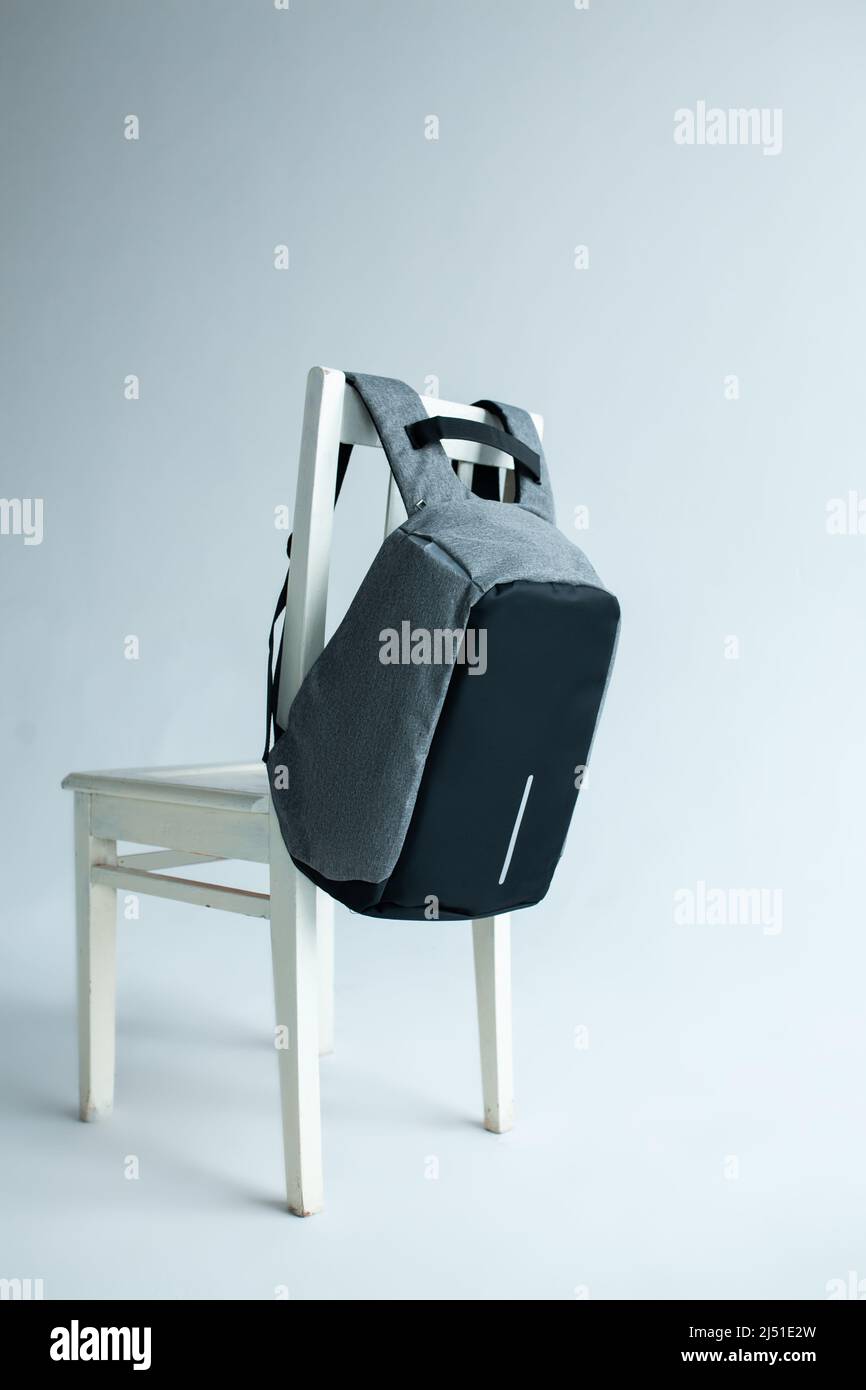 modern stylish backpack on chair studio shot Stock Photo - Alamy