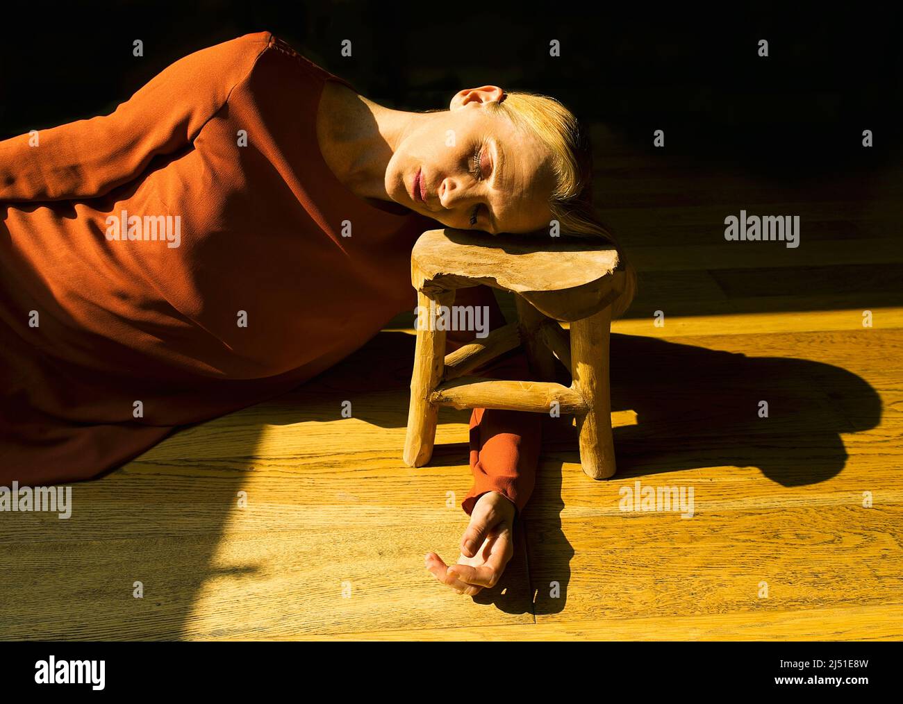 woman lying and leaning on a stool Stock Photo - Alamy