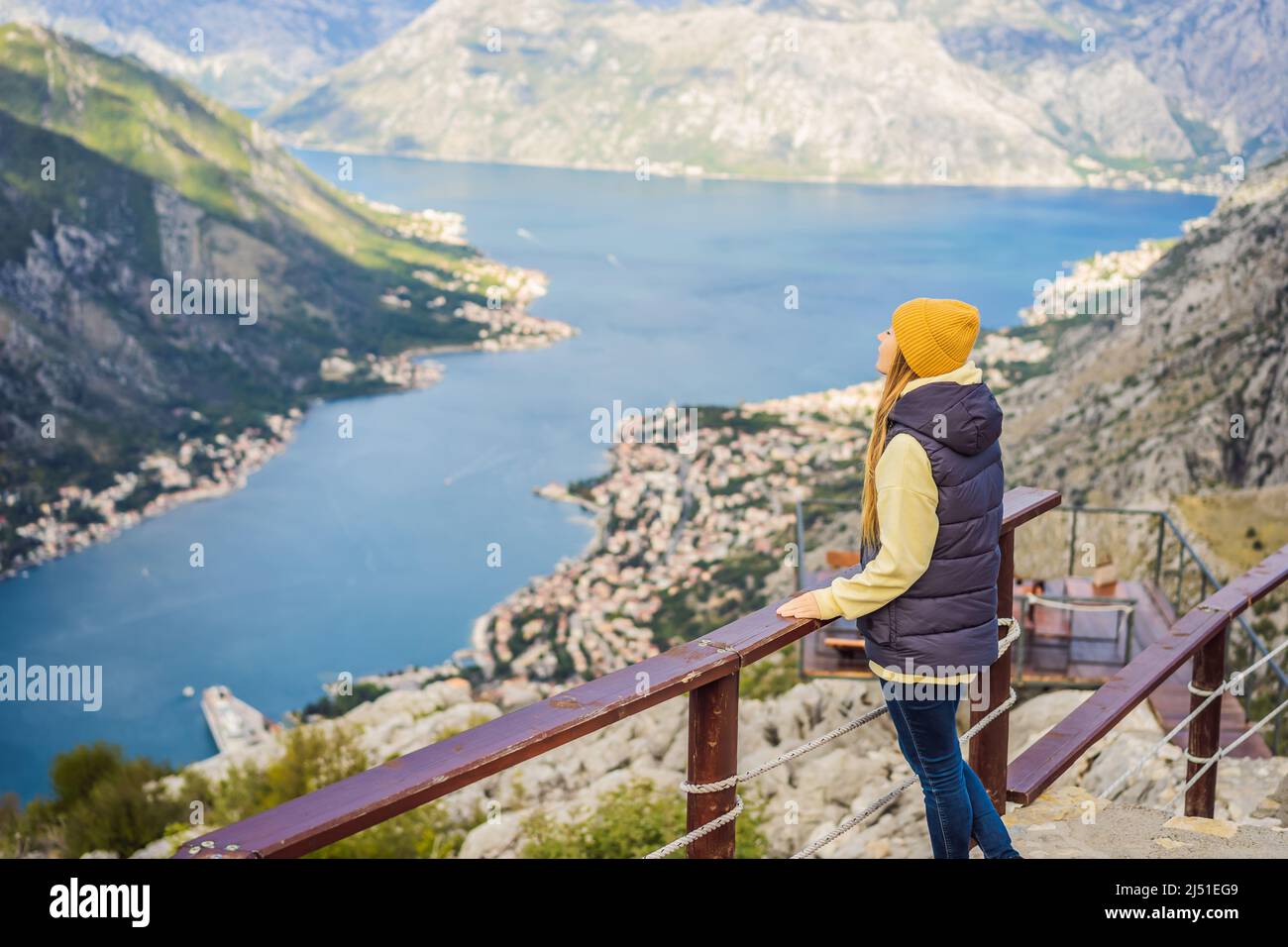 Woman tourist enjoys the view of Kotor. Montenegro. Bay of Kotor, Gulf ...