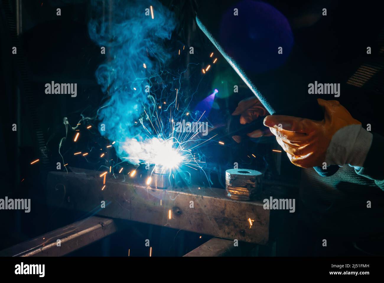 Industrial welder worker welding steel or iron in a factory Stock Photo ...