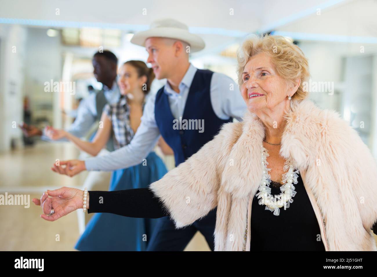 Group of different age dancers preparing swing performance Stock Photo ...